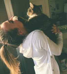30 Socially Awkward Cats Reacting Hilariously To “Hugs”