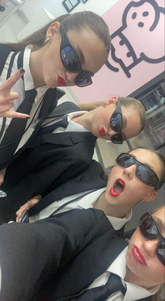 Go Bold with a Men in Black Costume Theme for Your Girl Group